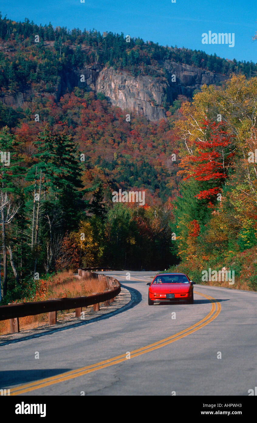 Red sports car on Route 112 on Kancamagus Pass through the White ...