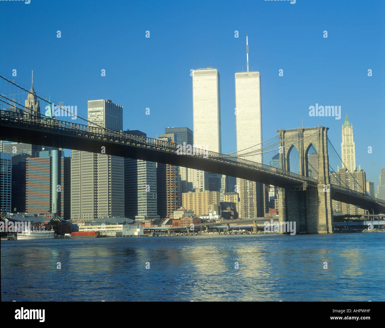 View from East River of the Brooklyn Bridge and skyline in New York ...