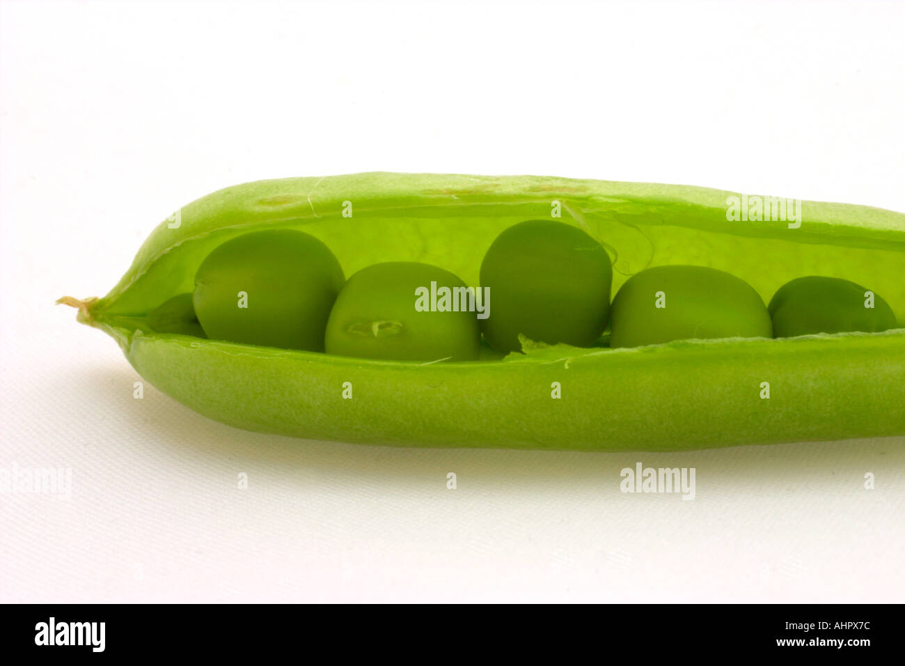 An open pea pod Stock Photo - Alamy