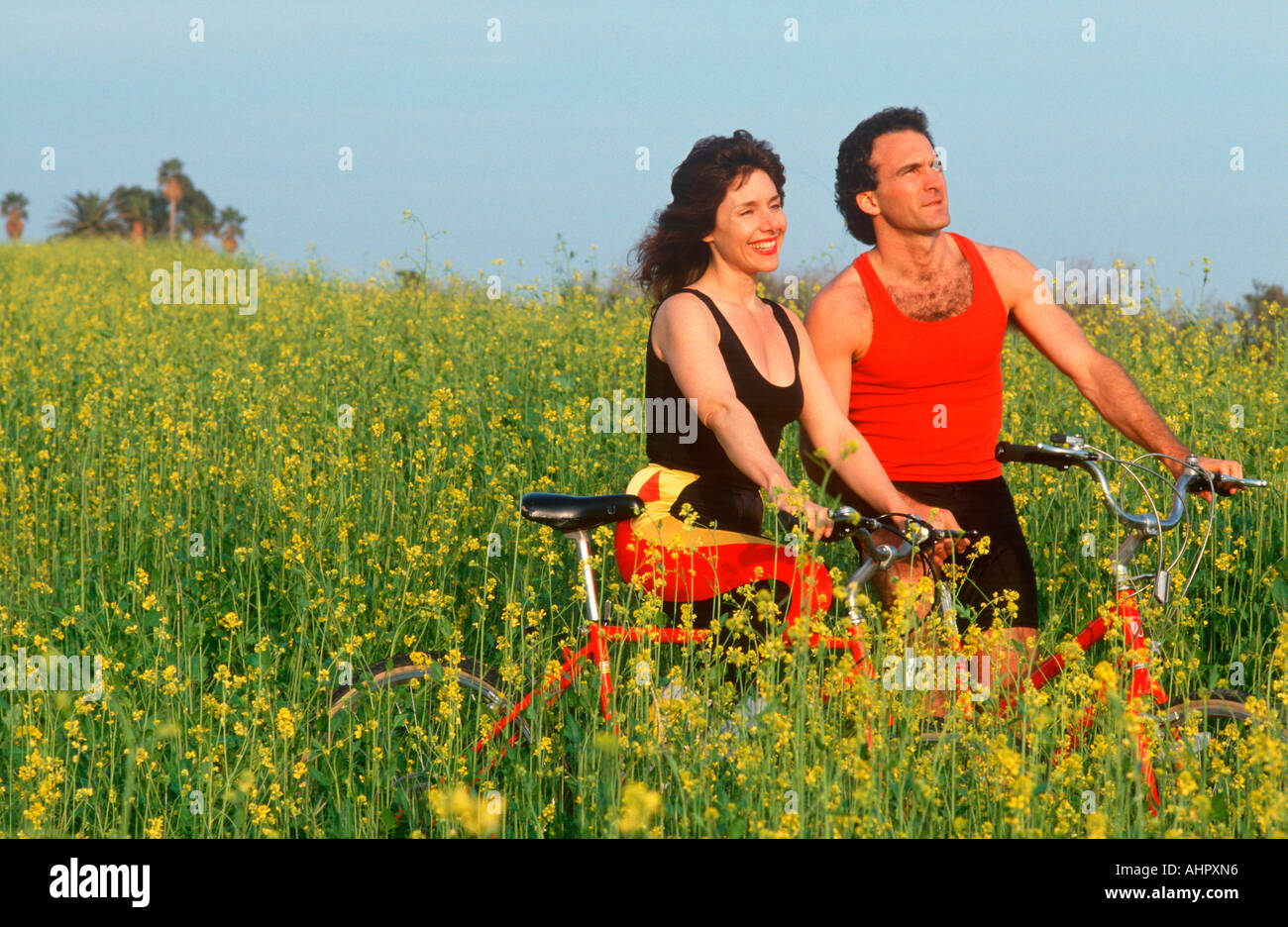 Couple resting during bicycle ride Stock Photo - Alamy