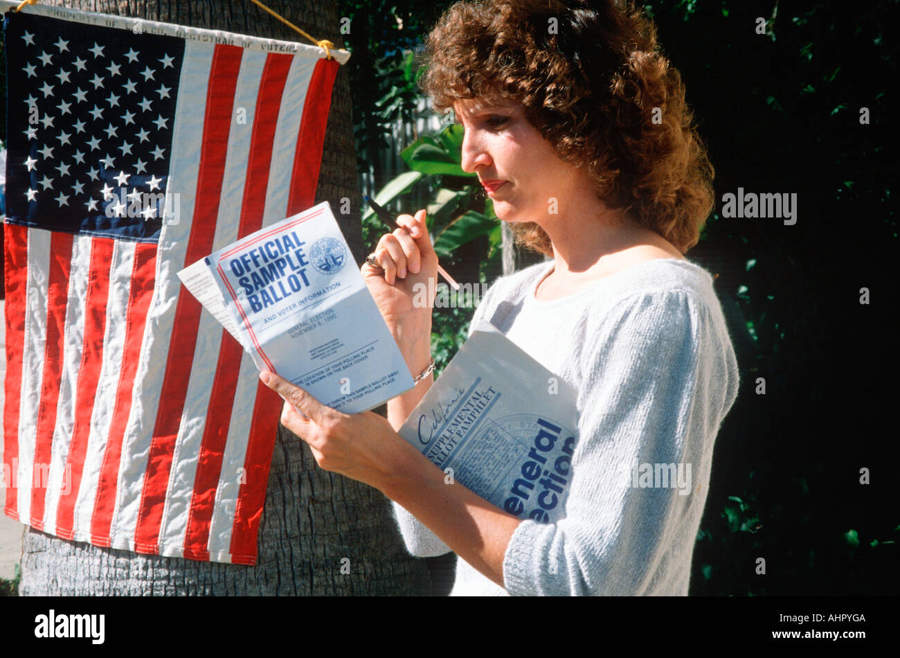 Female voter reading sample ballot at polling location Los Angeles ...