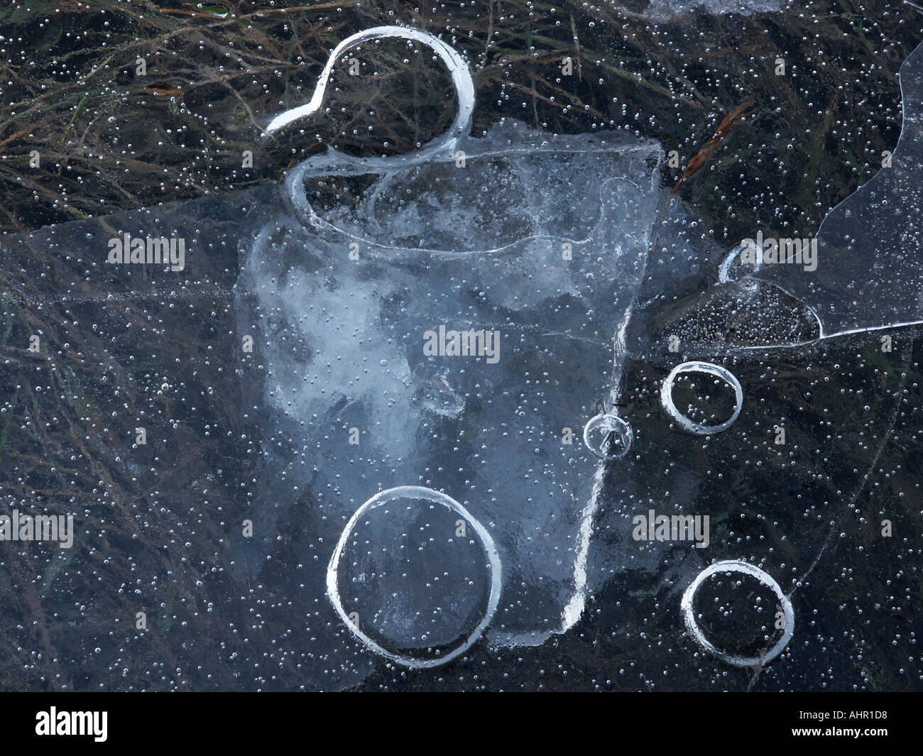 Patterns of bubbles trapped in ice Stock Photo - Alamy