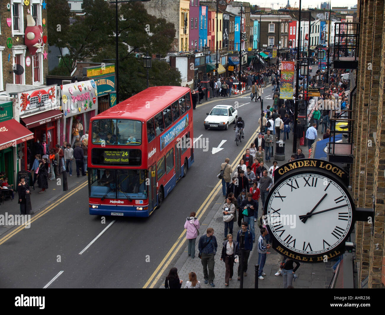 Red doubledecker London bus on Camden High Street sidewalks crowded ...