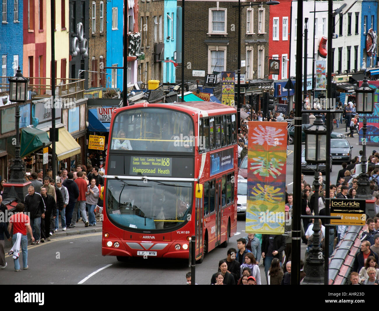 Red doubledecker London bus on Camden High Street sidewalks crowded ...