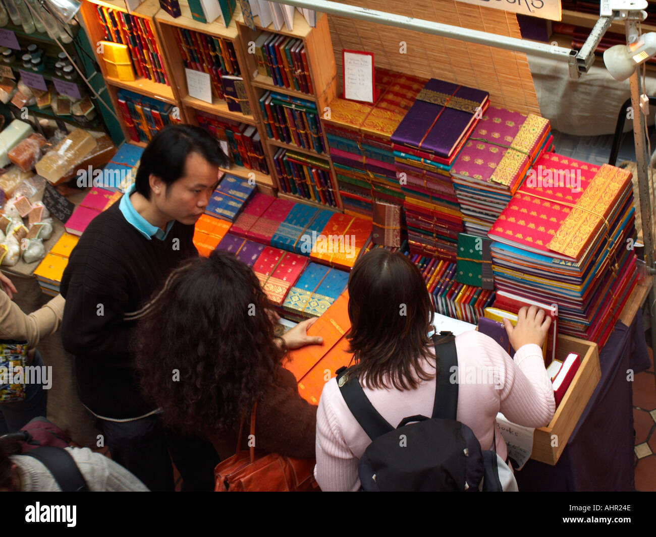 People shopping at a bookmaker s booth among the crafts stalls Camden ...