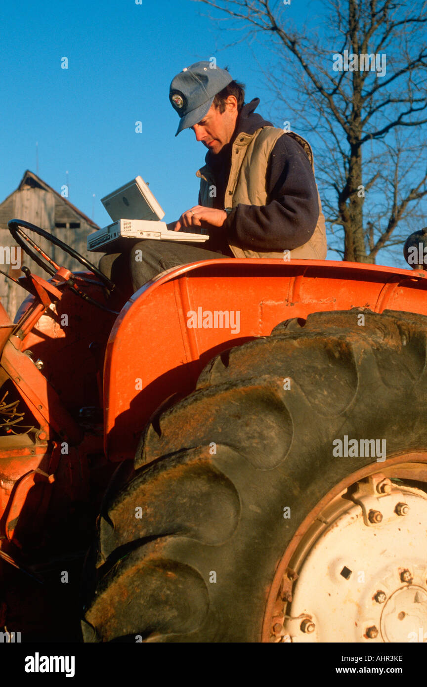 Farmer working on laptop computer on his tractor Missouri Stock Photo ...