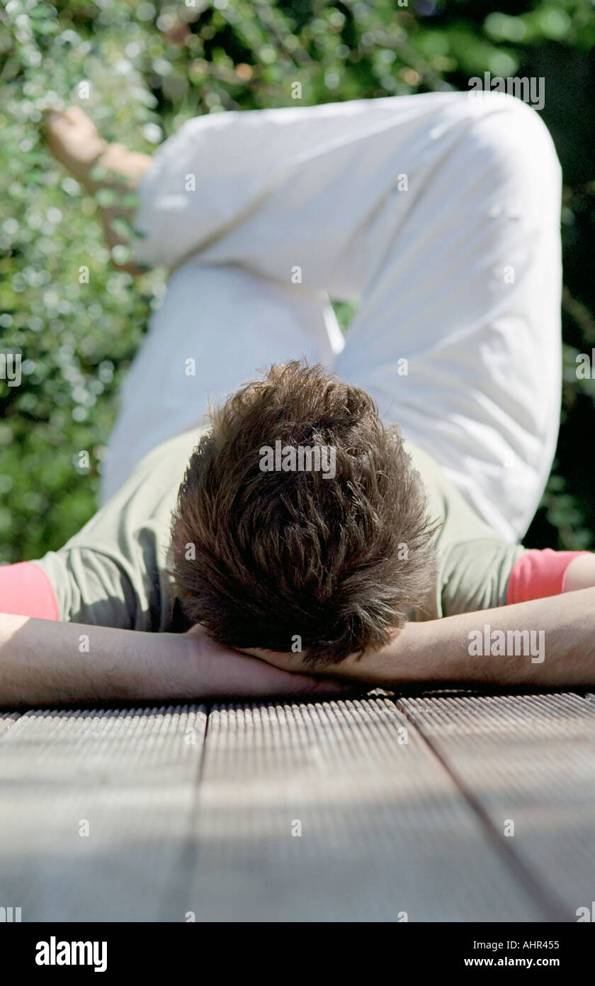 Relaxed young male lying down hi-res stock photography and images - Alamy