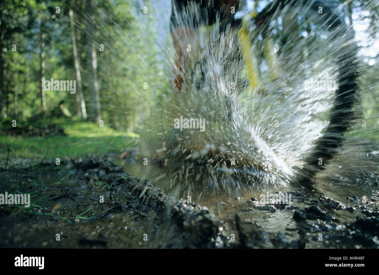 Cycling through puddle hi-res stock photography and images - Alamy