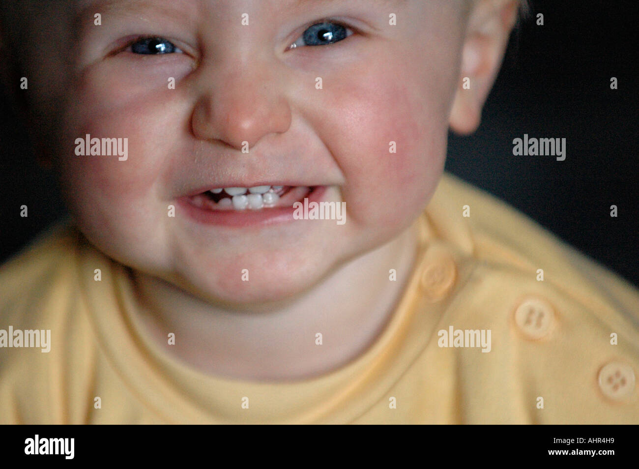 Baby cheeky expression hi-res stock photography and images - Alamy