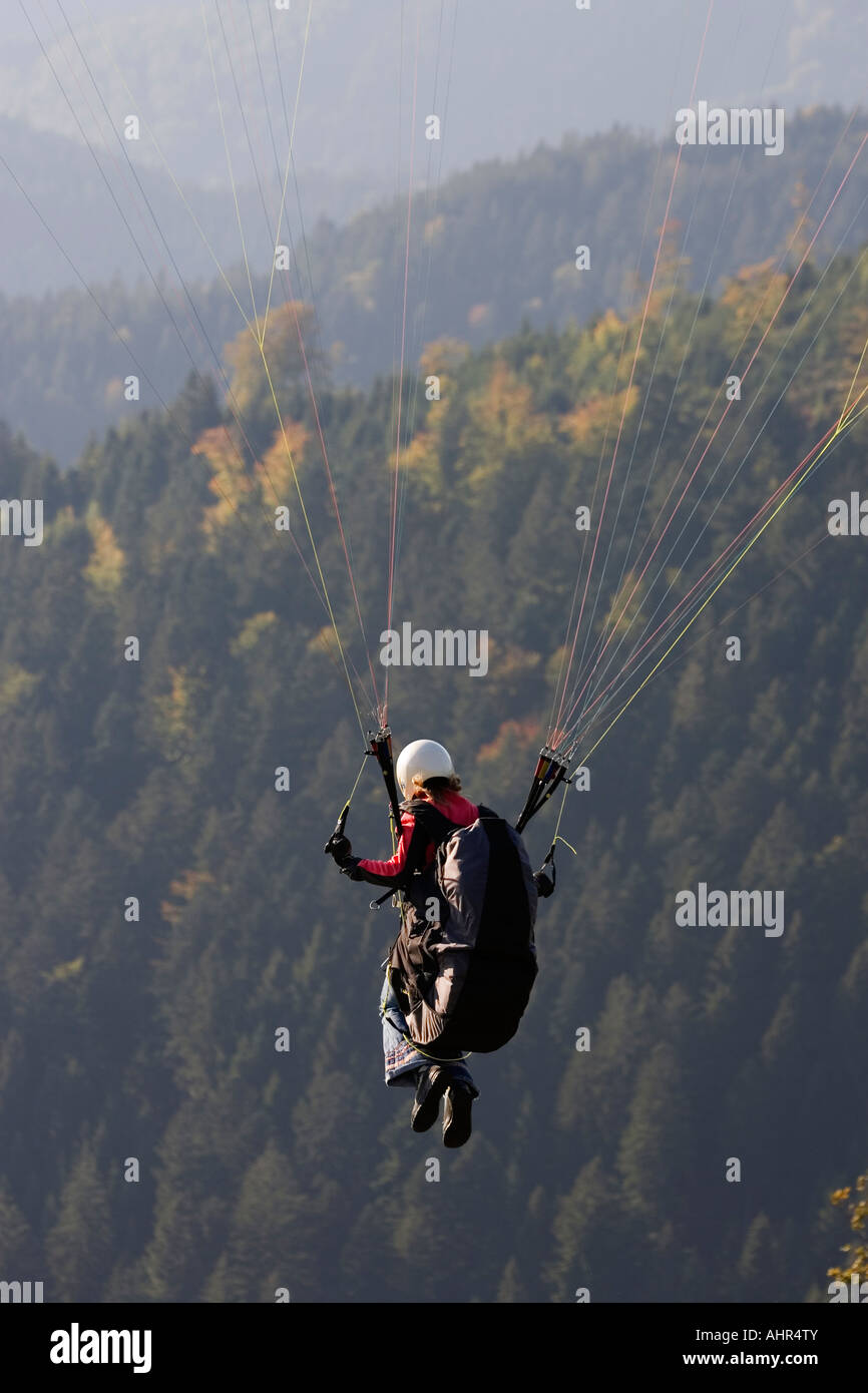 Paraglider pilot launching near Zuflucht Rossbuehl Black Forest Germany ...
