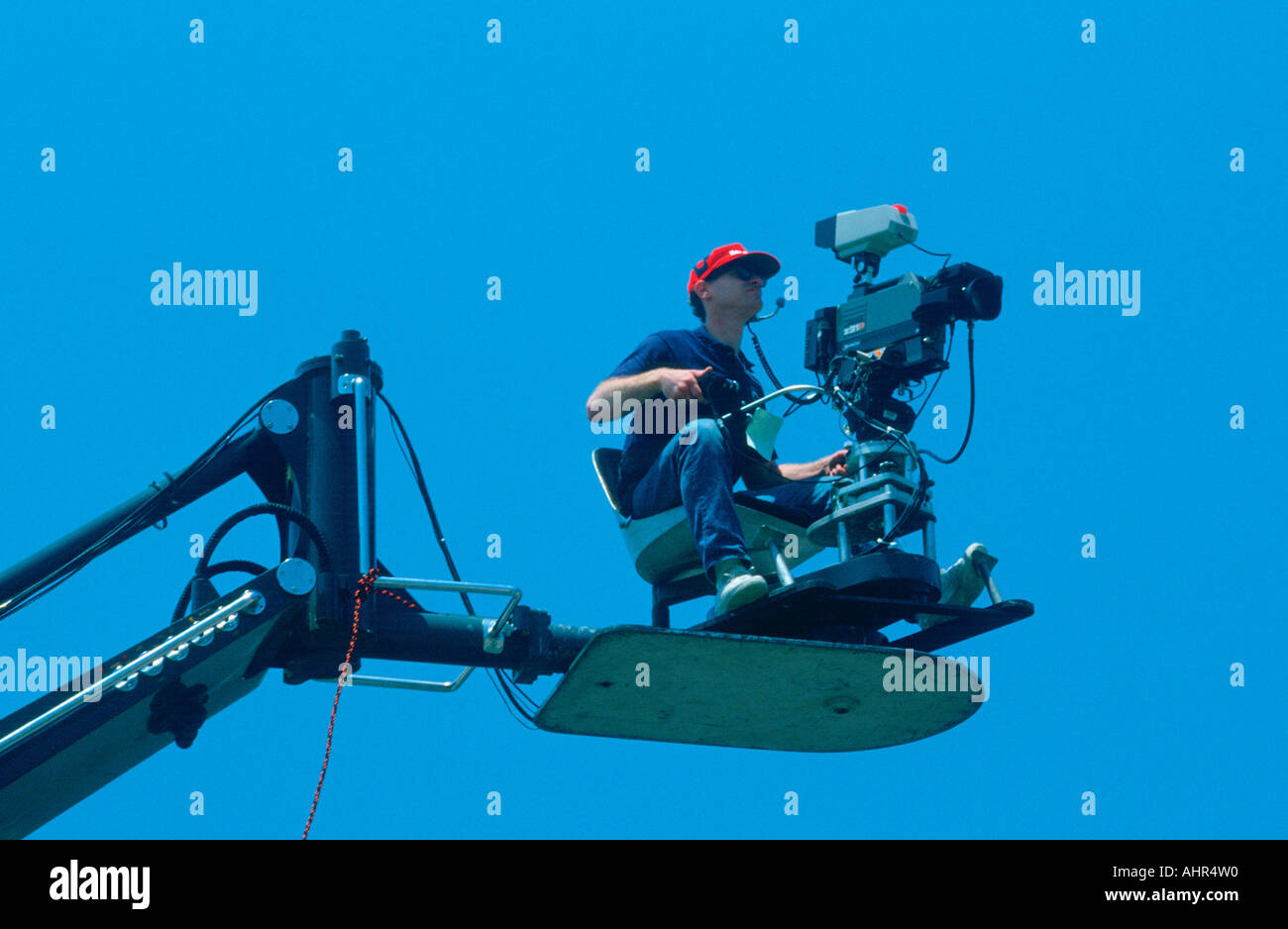 Cameraman on camera boom Stock Photo - Alamy