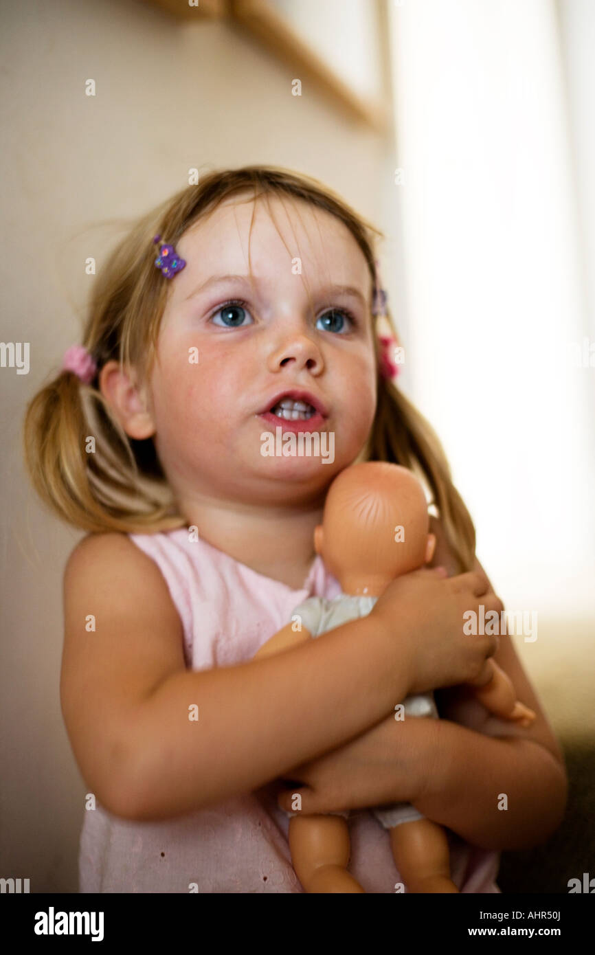 portrait of girl with doll Stock Photo - Alamy