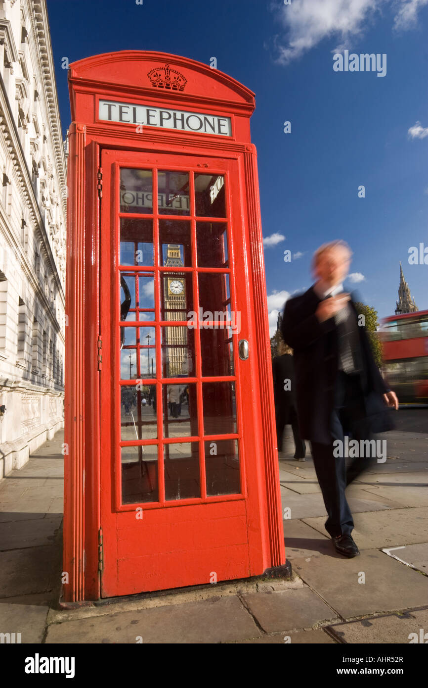 Red Telephone box and business man Stock Photo - Alamy