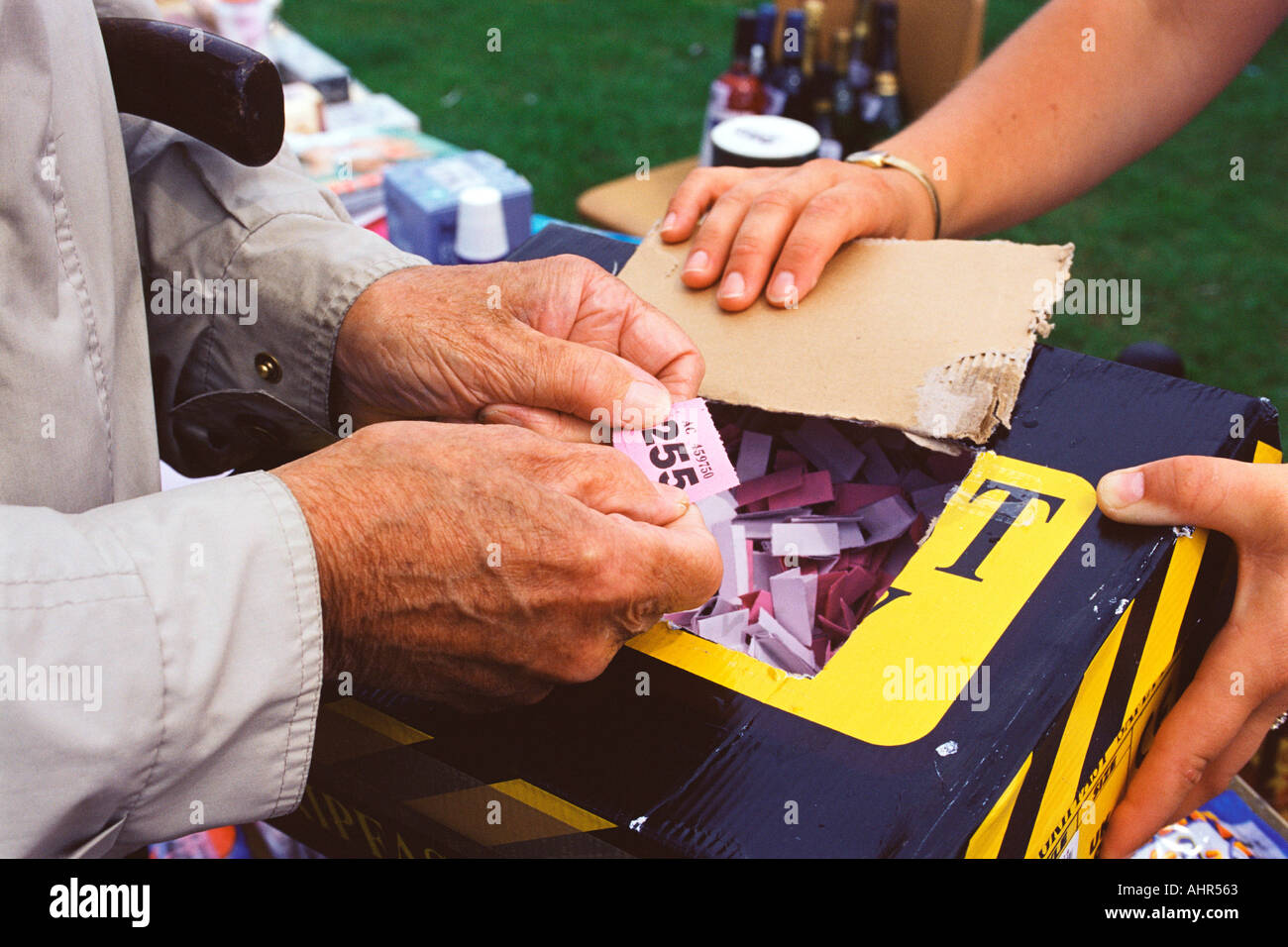 Man holding raffle ticket ahr563 hi-res stock photography and images ...
