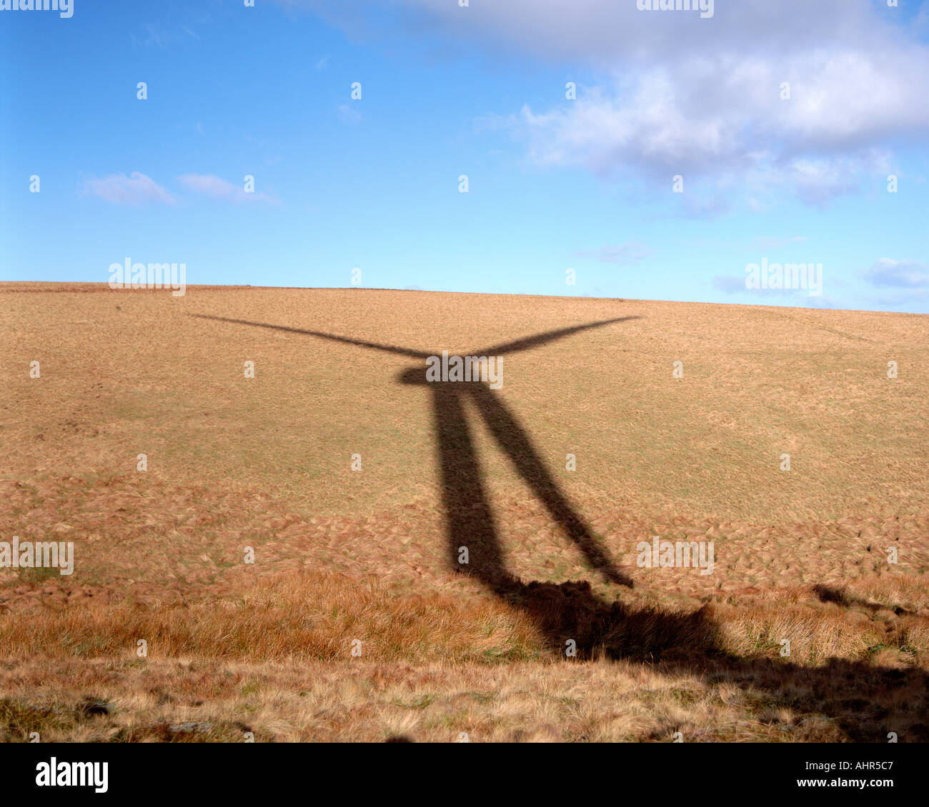 Wind turbine shadow on hill Stock Photo - Alamy