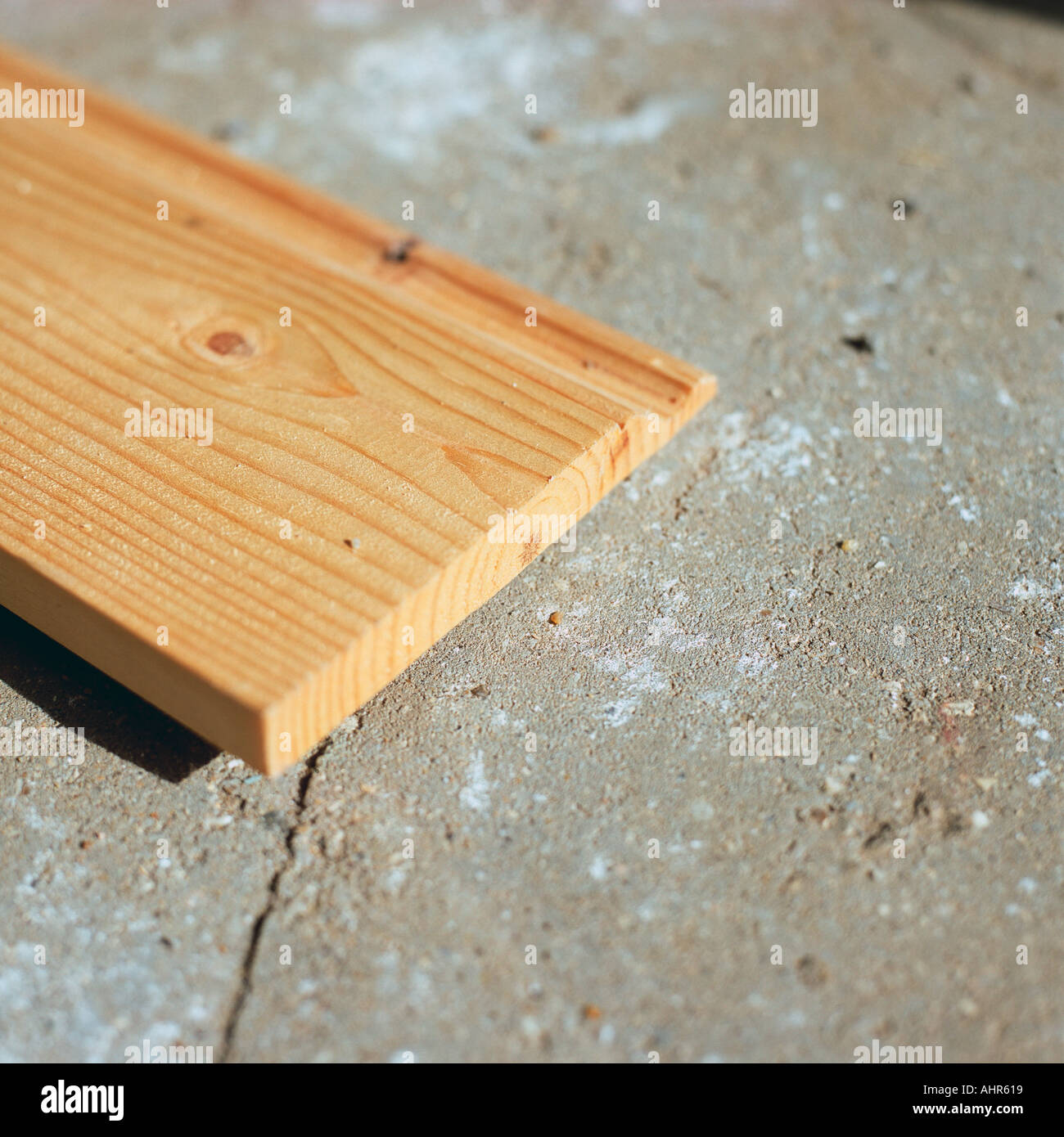Timber on concrete floor Stock Photo - Alamy