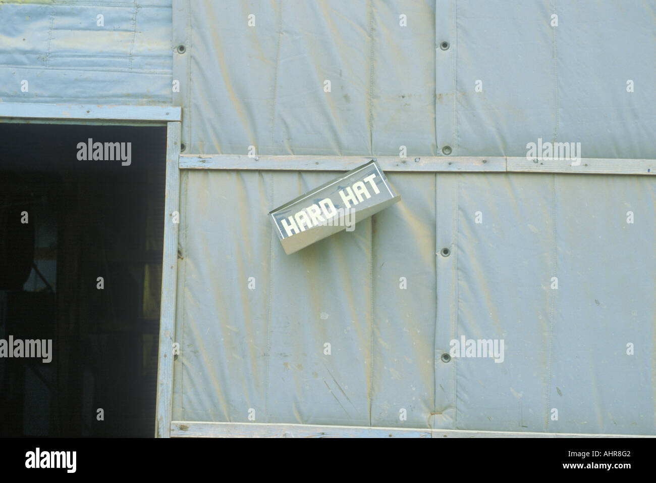 A sign requiring hard hats to be worn on a construction site in ...