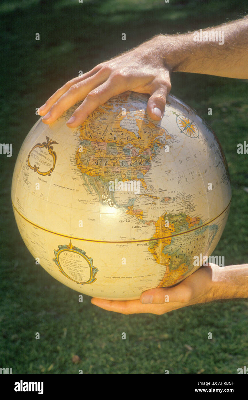 Many hands globe earth hi-res stock photography and images - Alamy