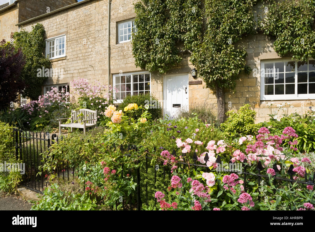 Cottage gardens in the Cotswold village of Blockley, Gloucestershire UK ...