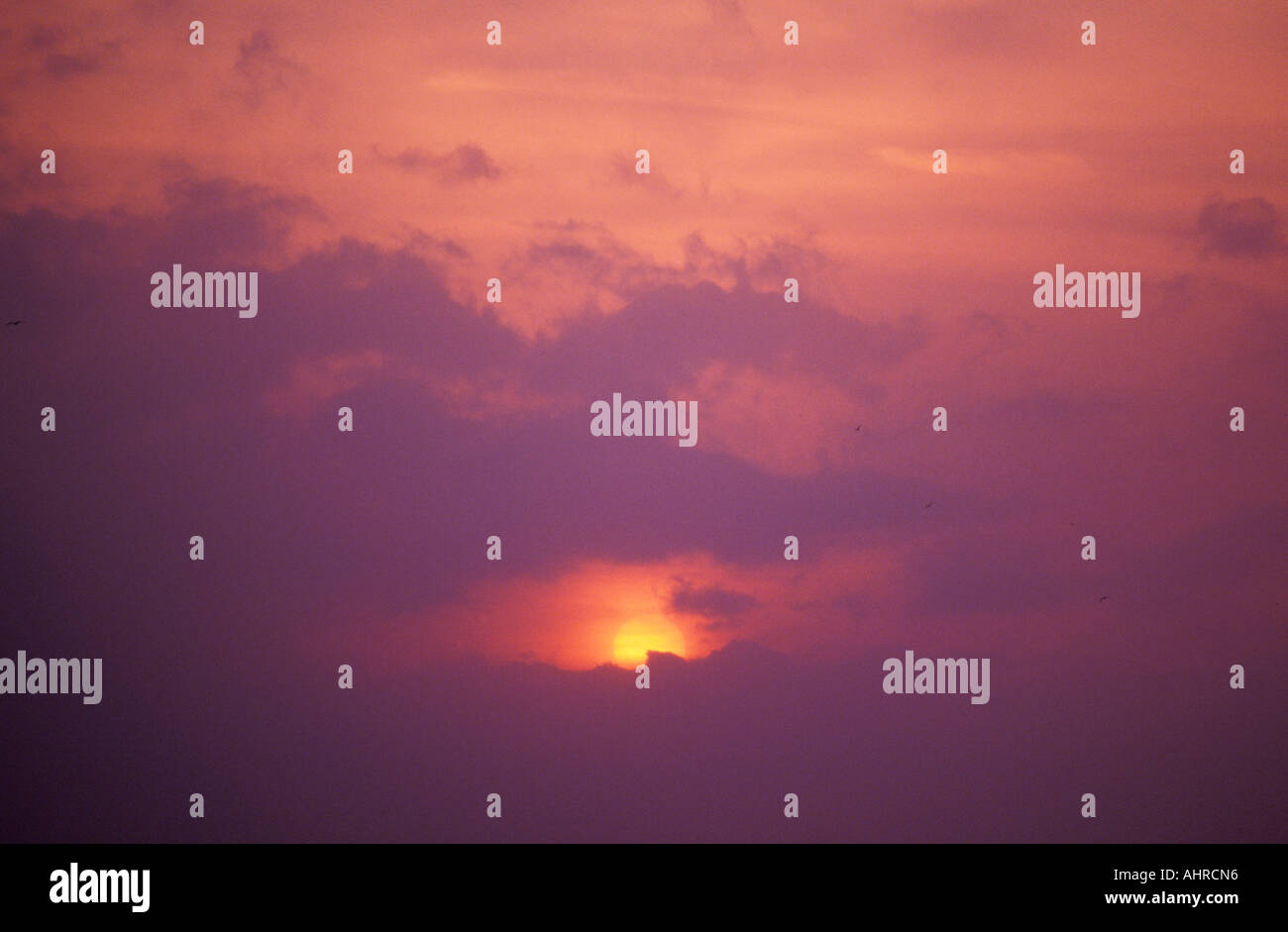 Sun Setting Through Clouds Florida Keys Stock Photo - Alamy