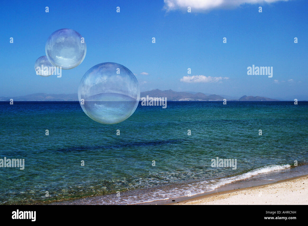 3 Bubbles floating over the sea Stock Photo - Alamy