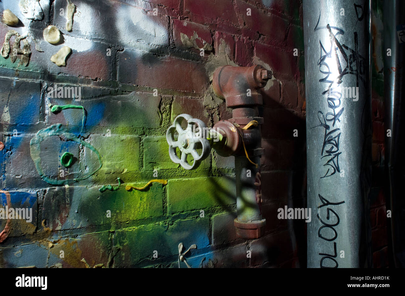 Graffiti covered wall and valve Ann Arbor Michigan Stock Photo - Alamy