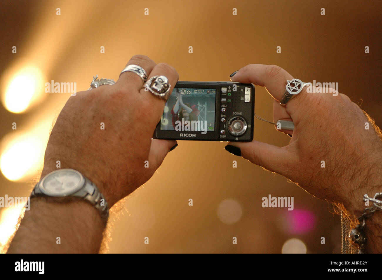 spectator taking snapshot at rock concert with digital camera Stock ...