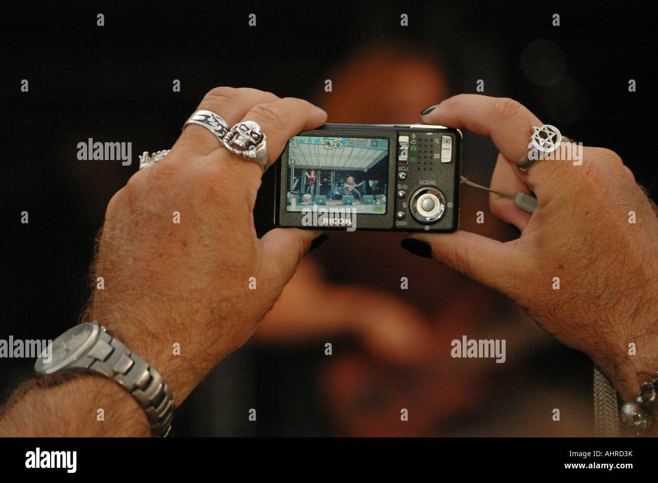 spectator taking snapshot at rock concert with digital camera Stock ...