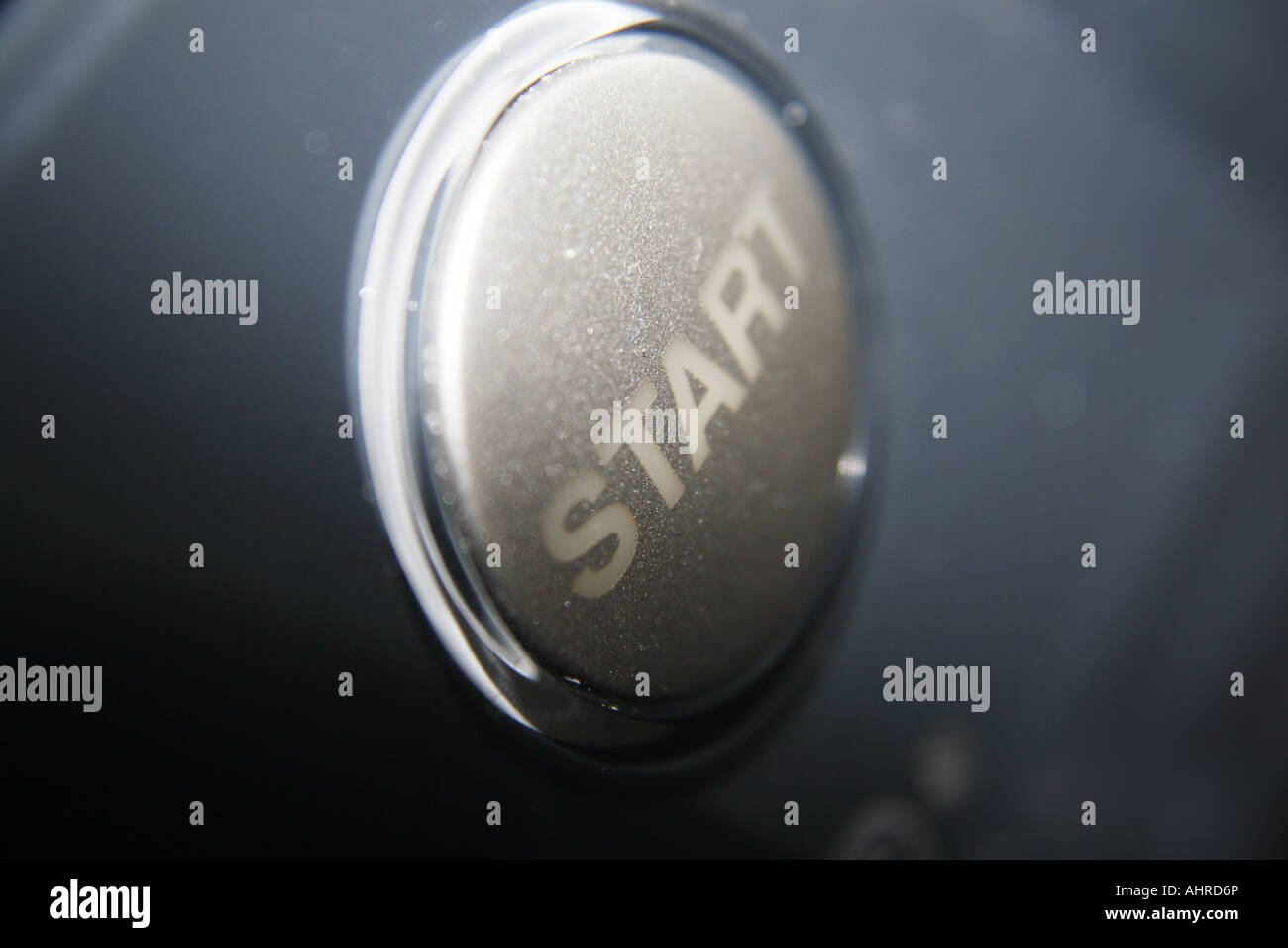 start button on washing machine Stock Photo - Alamy