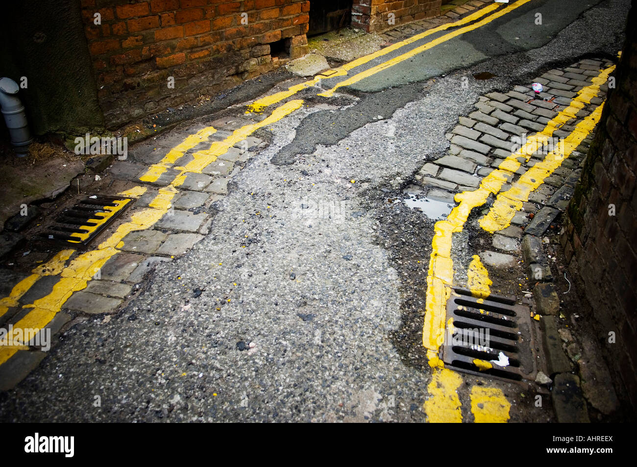 Parking restrictions in alley Stock Photo - Alamy
