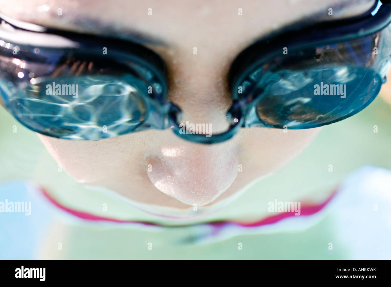 close up of a womans face wearing goggles in the pool Stock Photo - Alamy