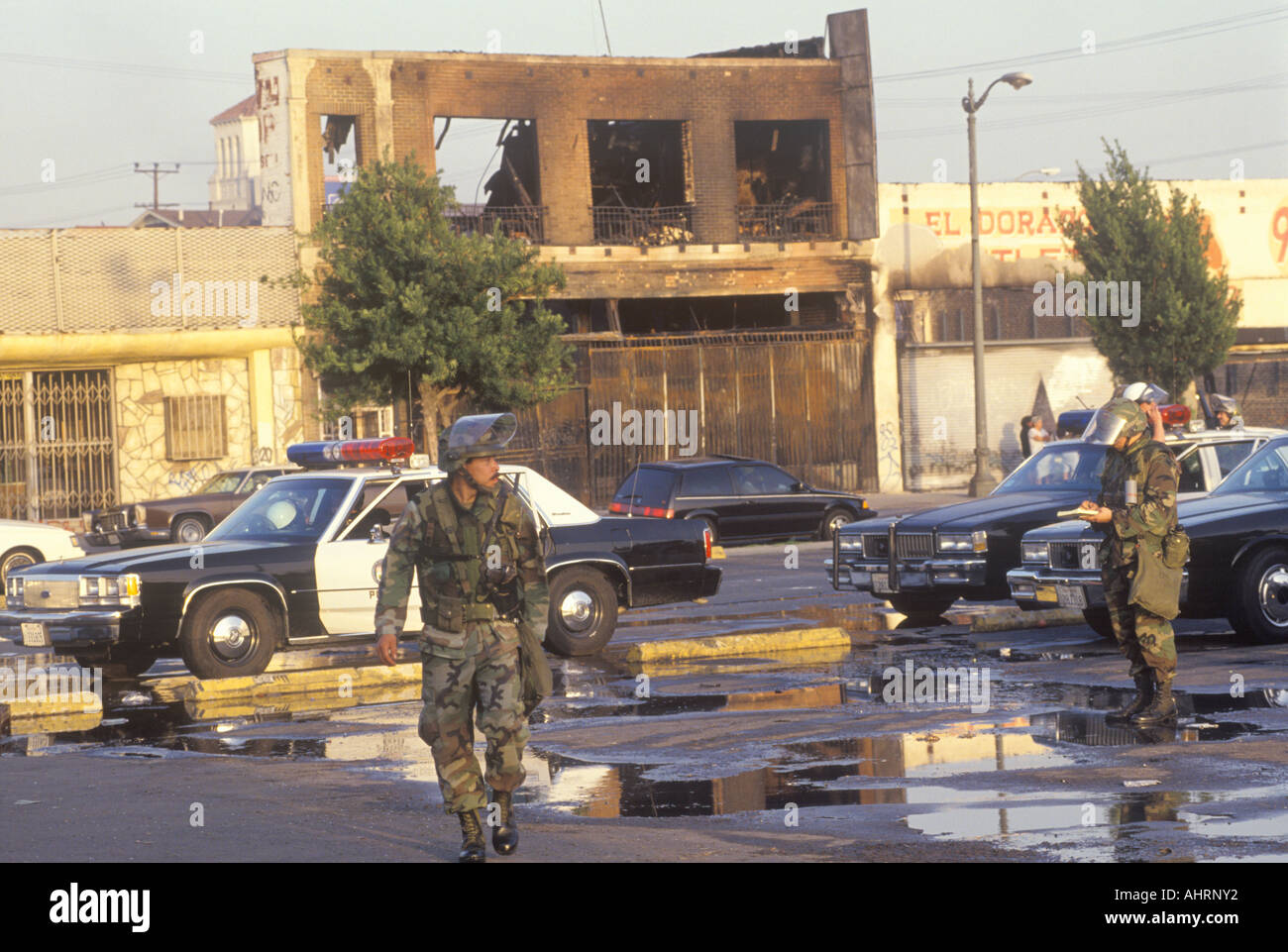 National Guardsmen and police cars patrolling during 1992 riots South ...