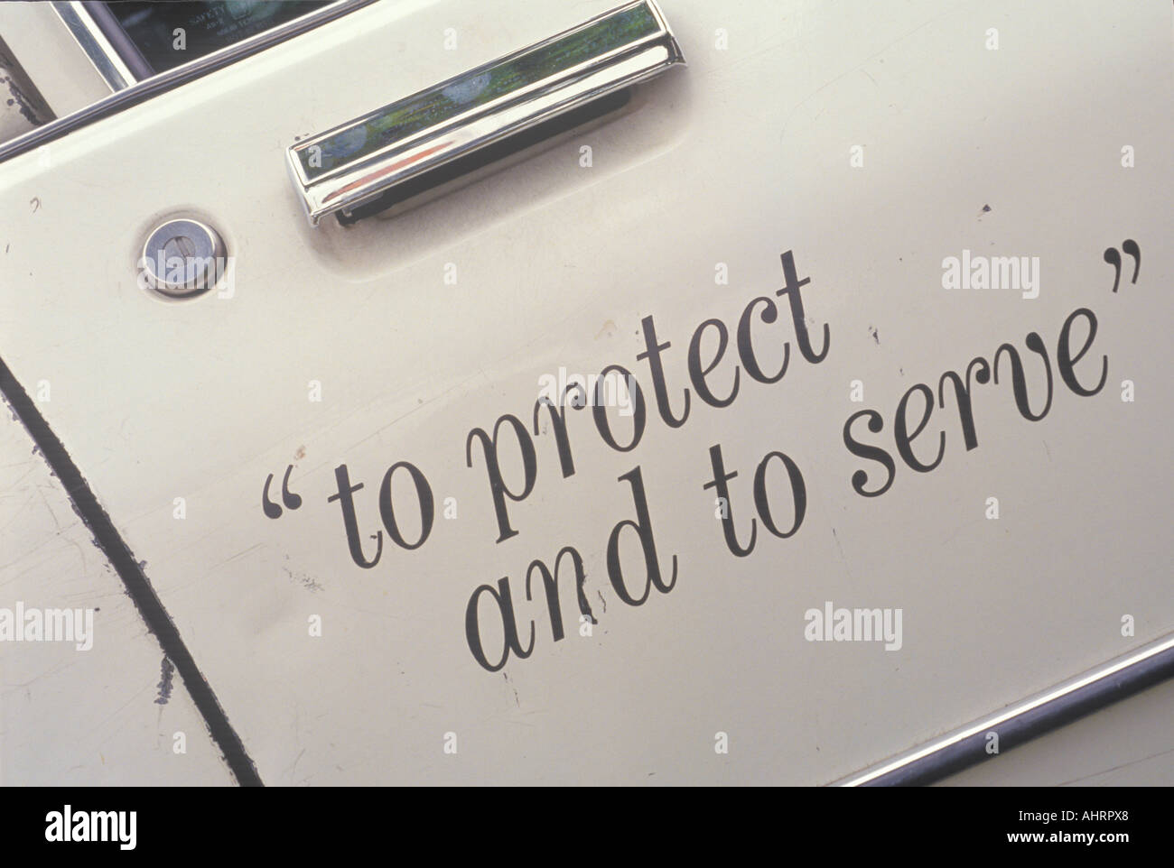 To protect and to serve on door of LA police car California Stock Photo ...