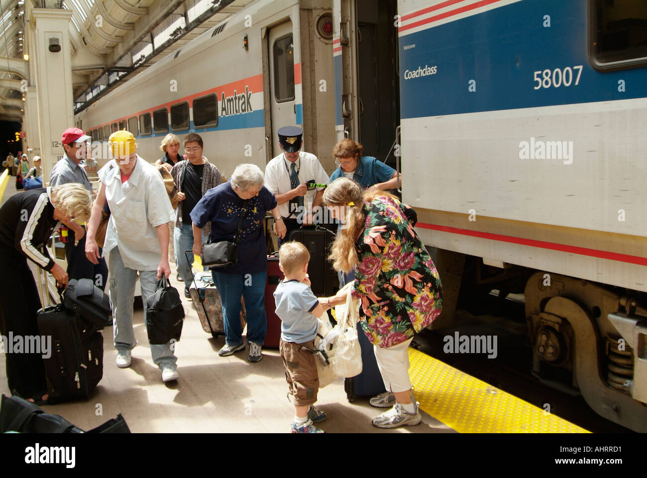 Families disembark from an Amtrak train in Union Station Chicago ...