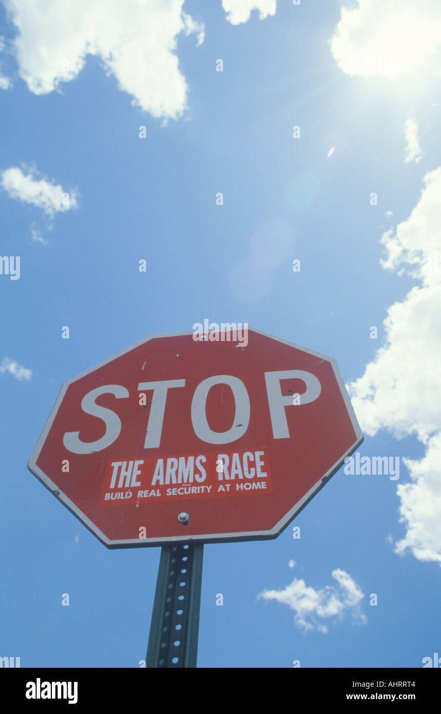 Stop sign with The arms race added Stock Photo - Alamy