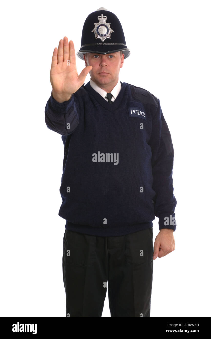 British Police Officer gesturing for you to STOP Stock Photo - Alamy