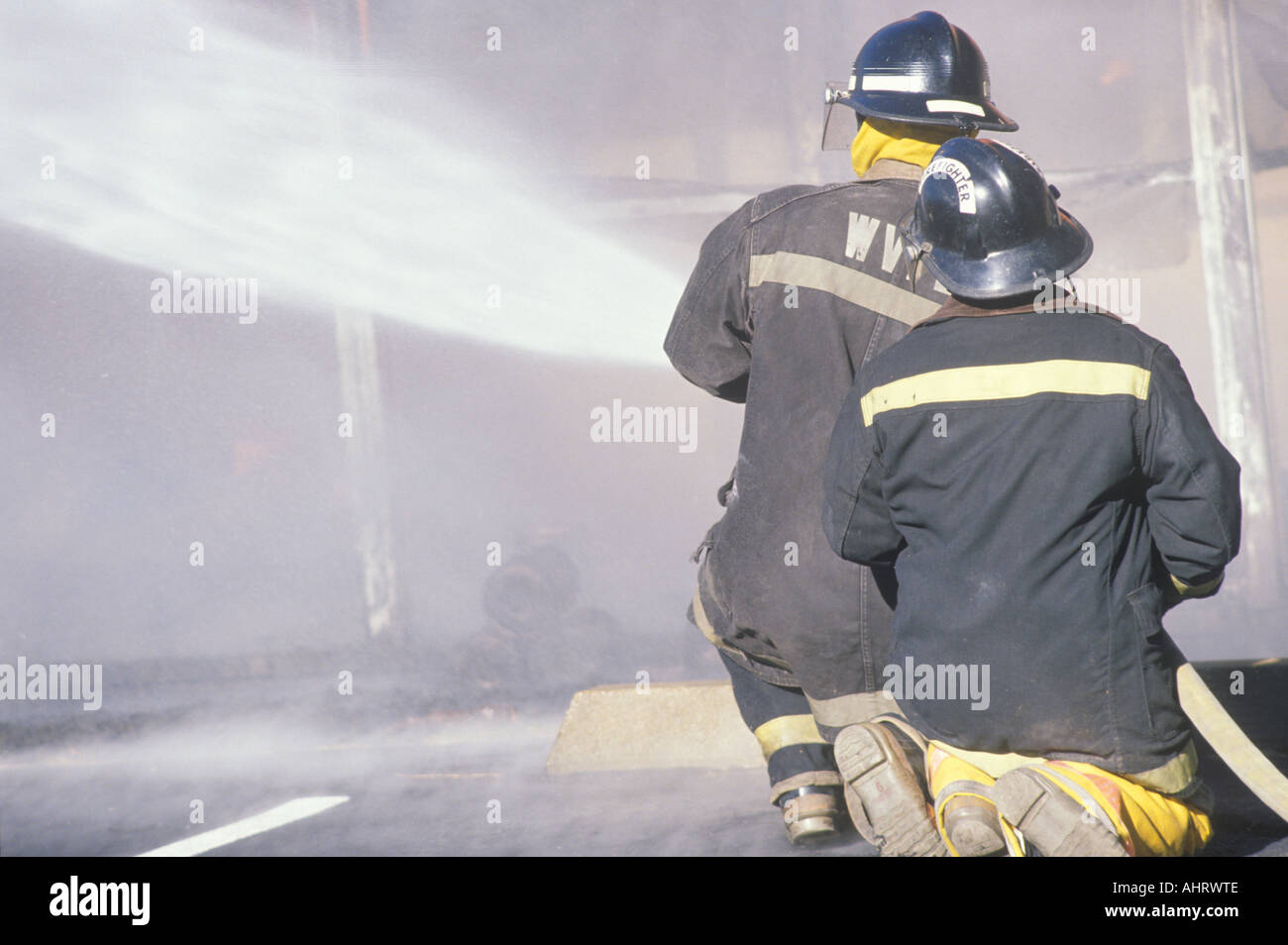 Firemen putting out a house on fire West Virginia Stock Photo - Alamy