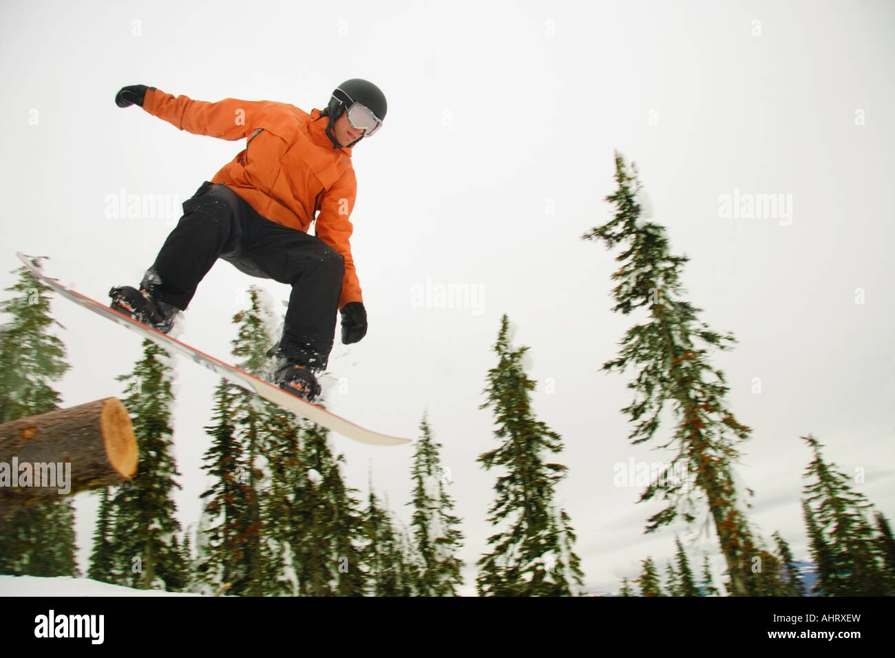 Snowboarder in mid air Stock Photo - Alamy