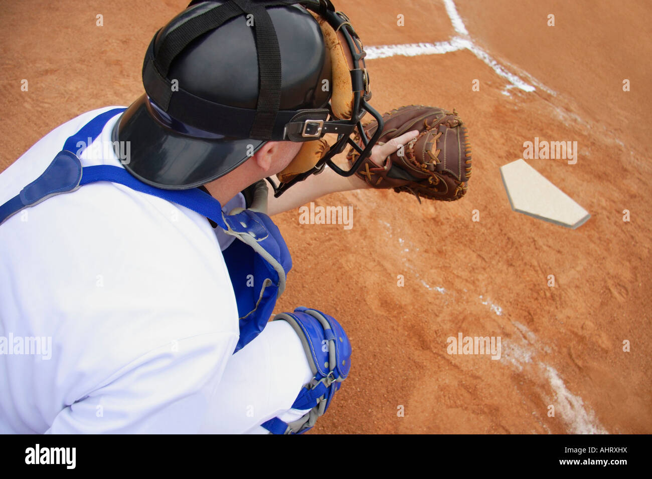 Back catcher ready to catch the ball Stock Photo - Alamy