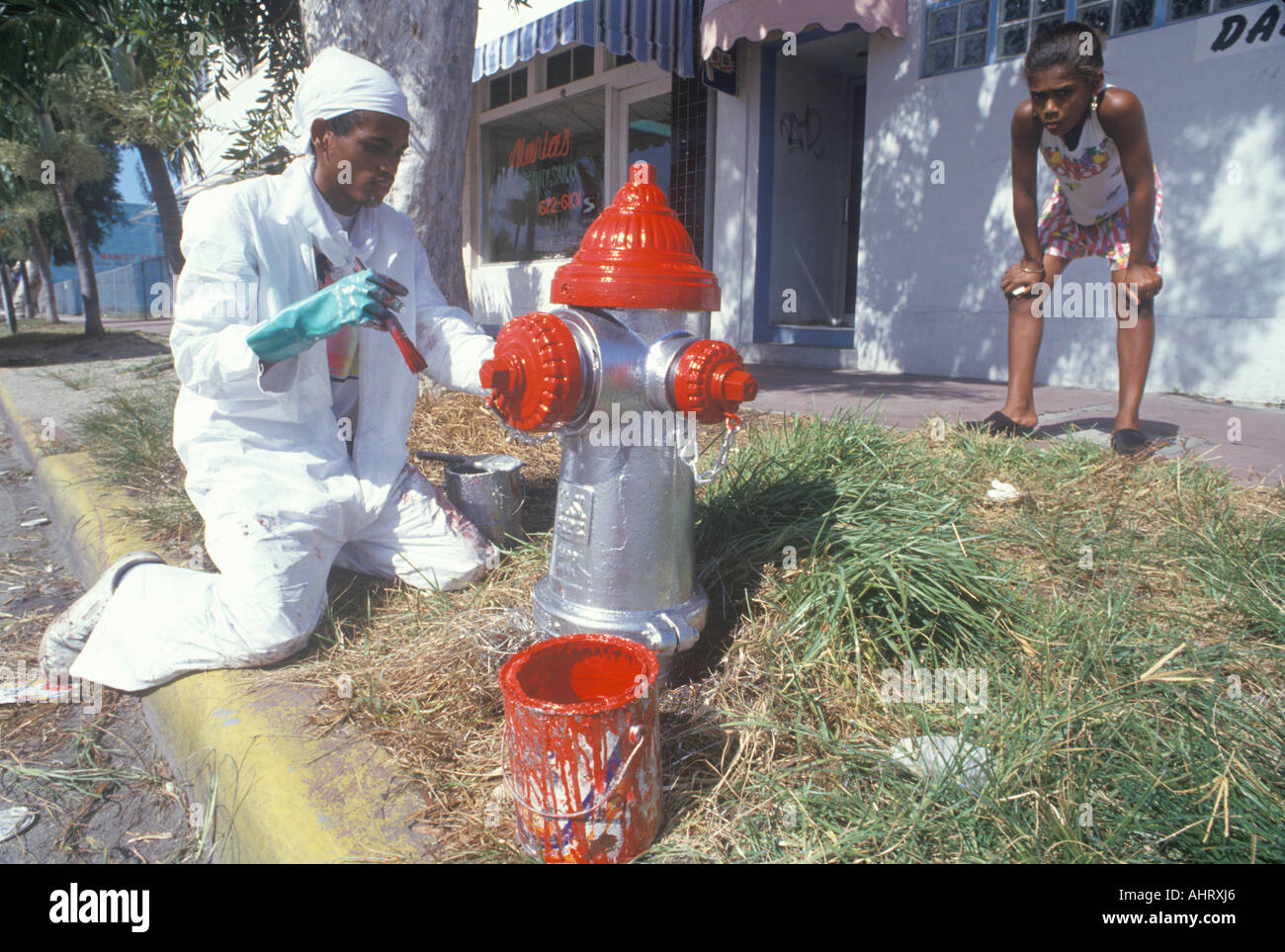 Man painting a fire hydrant South Beach Florida Stock Photo - Alamy