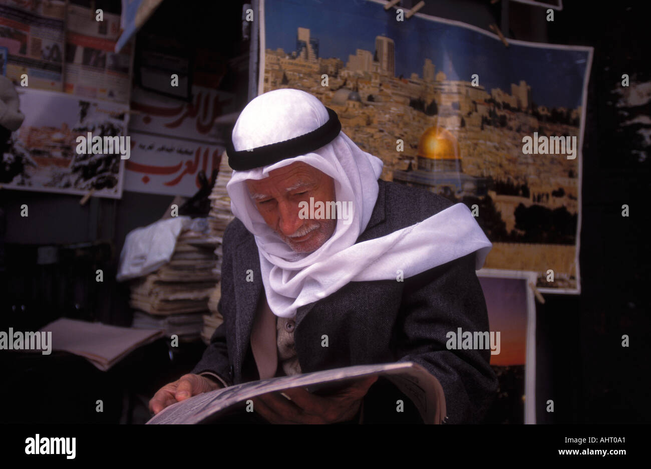 Elderly Palestinian man reading the newspaper, Jerusalem, Israel Stock ...