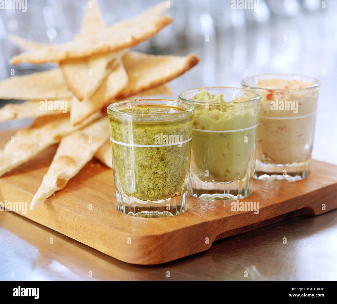 crusty flatbread with three dips Stock Photo - Alamy