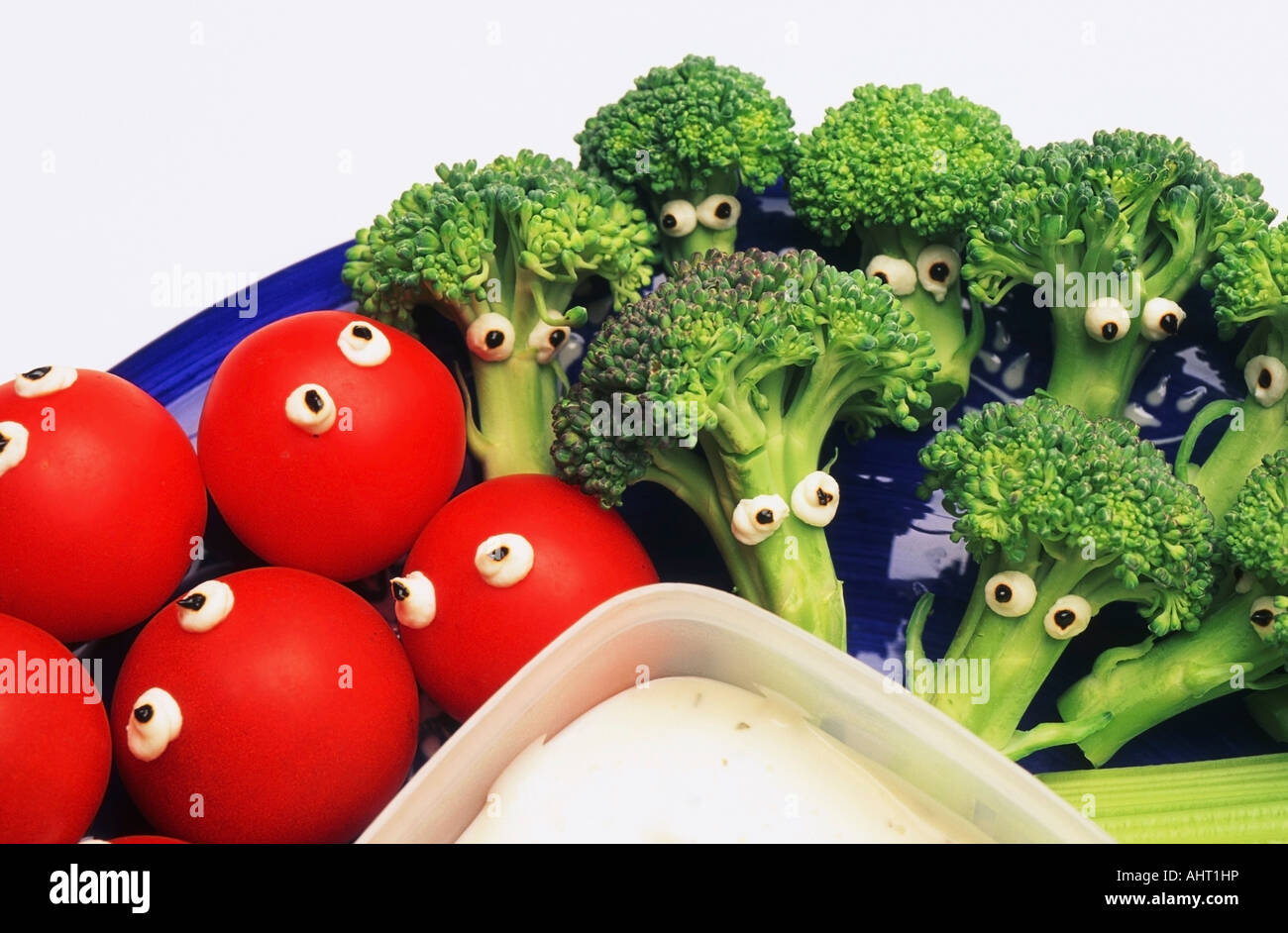 Personified cherry tomatoes and broccoli Stock Photo - Alamy
