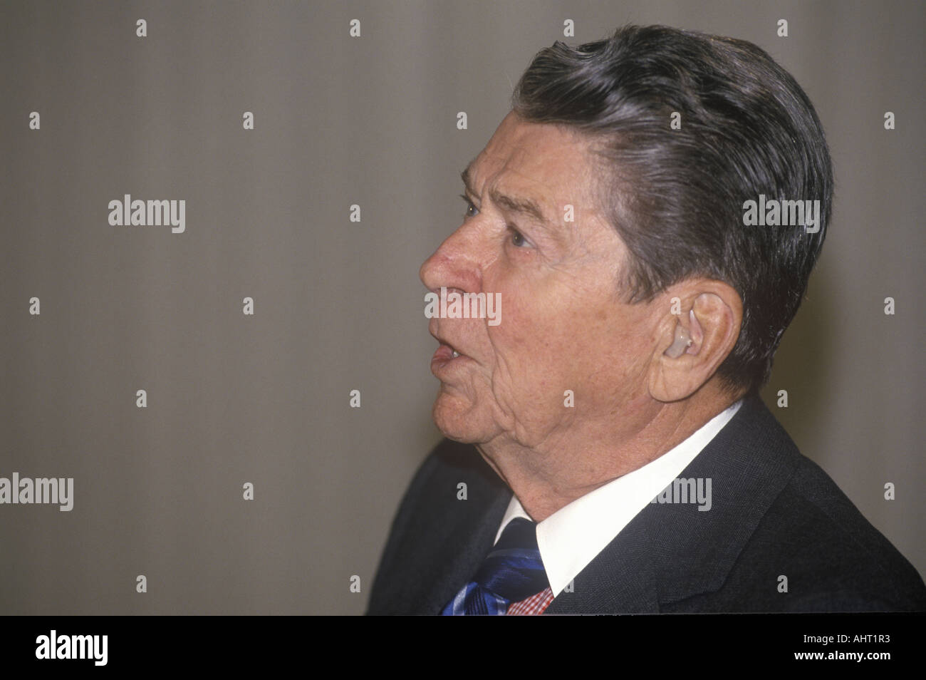 President Reagan wearing hearing aid presents an introduction for the ...