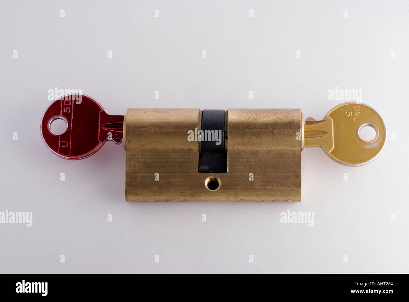 two keys (red key and gold key) and lock on white background Stock ...