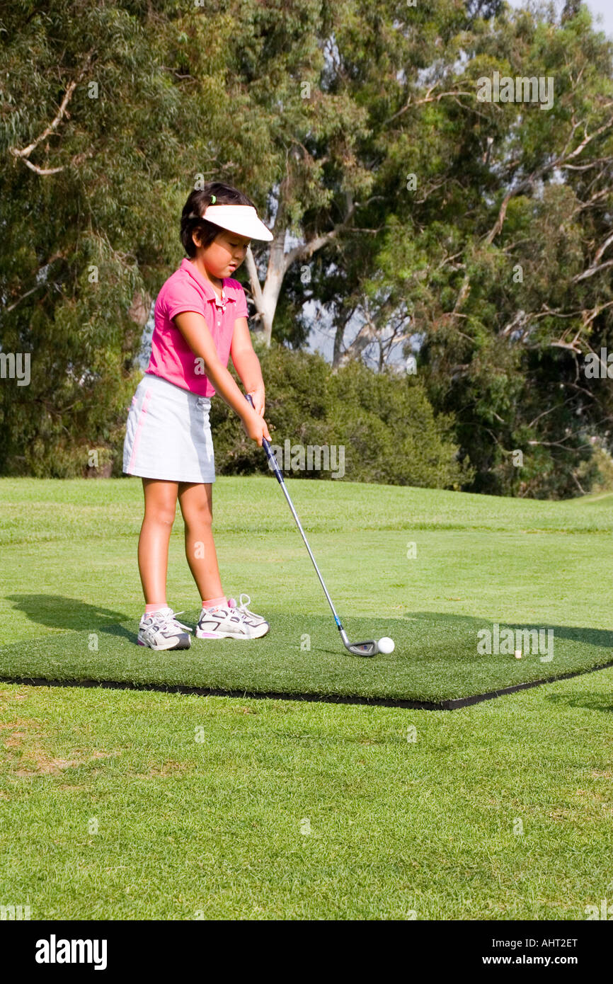 Young Girl Playing Golf Stock Photo - Alamy