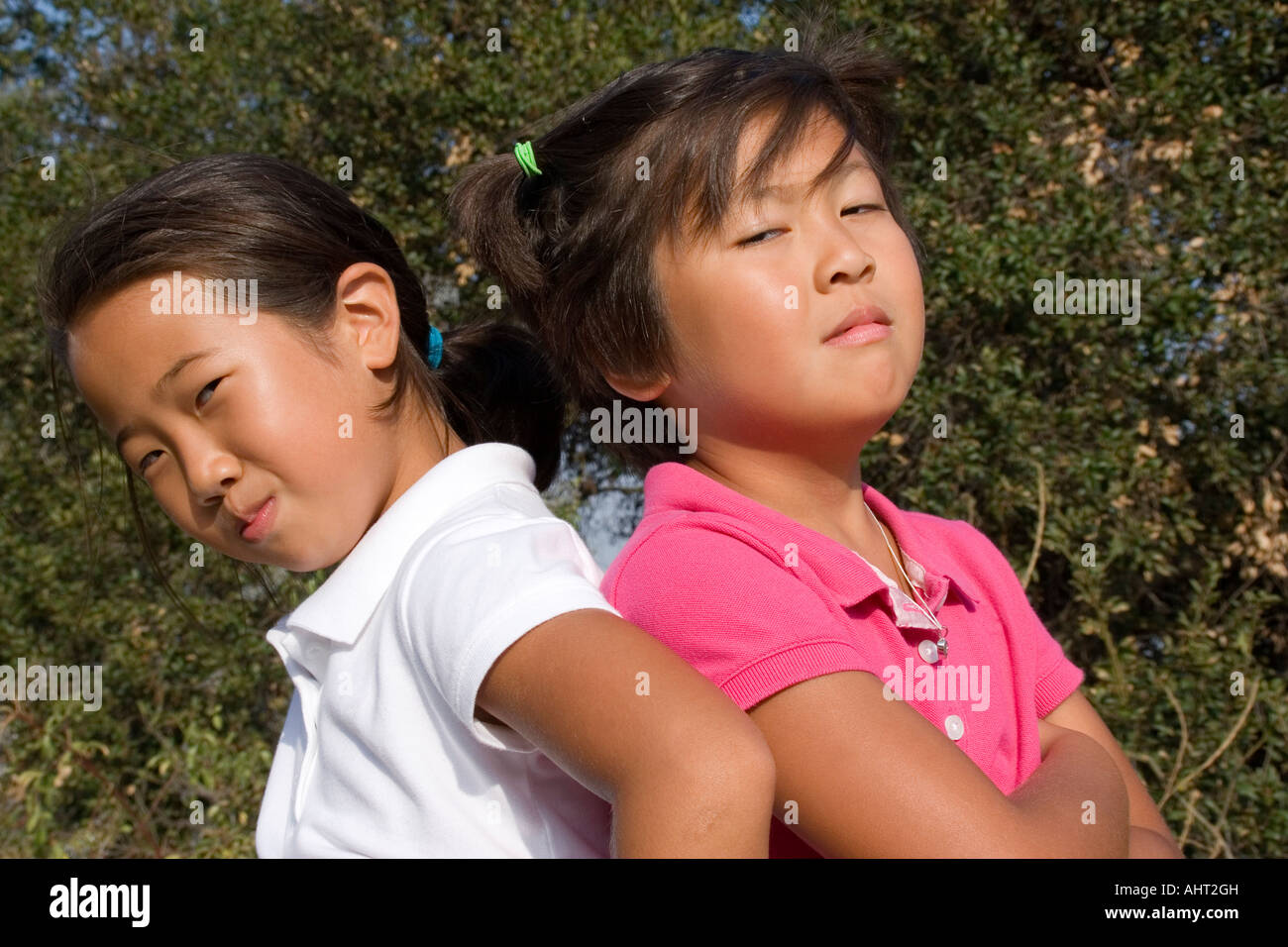 Two Young Girls Back to Back Stock Photo - Alamy