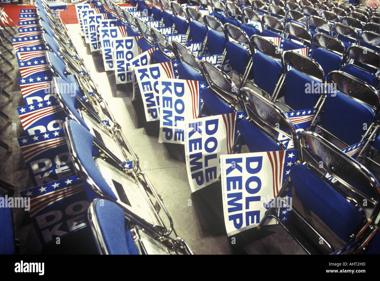 Rows of folded chairs and Dole Kemp signs at the Republican National ...