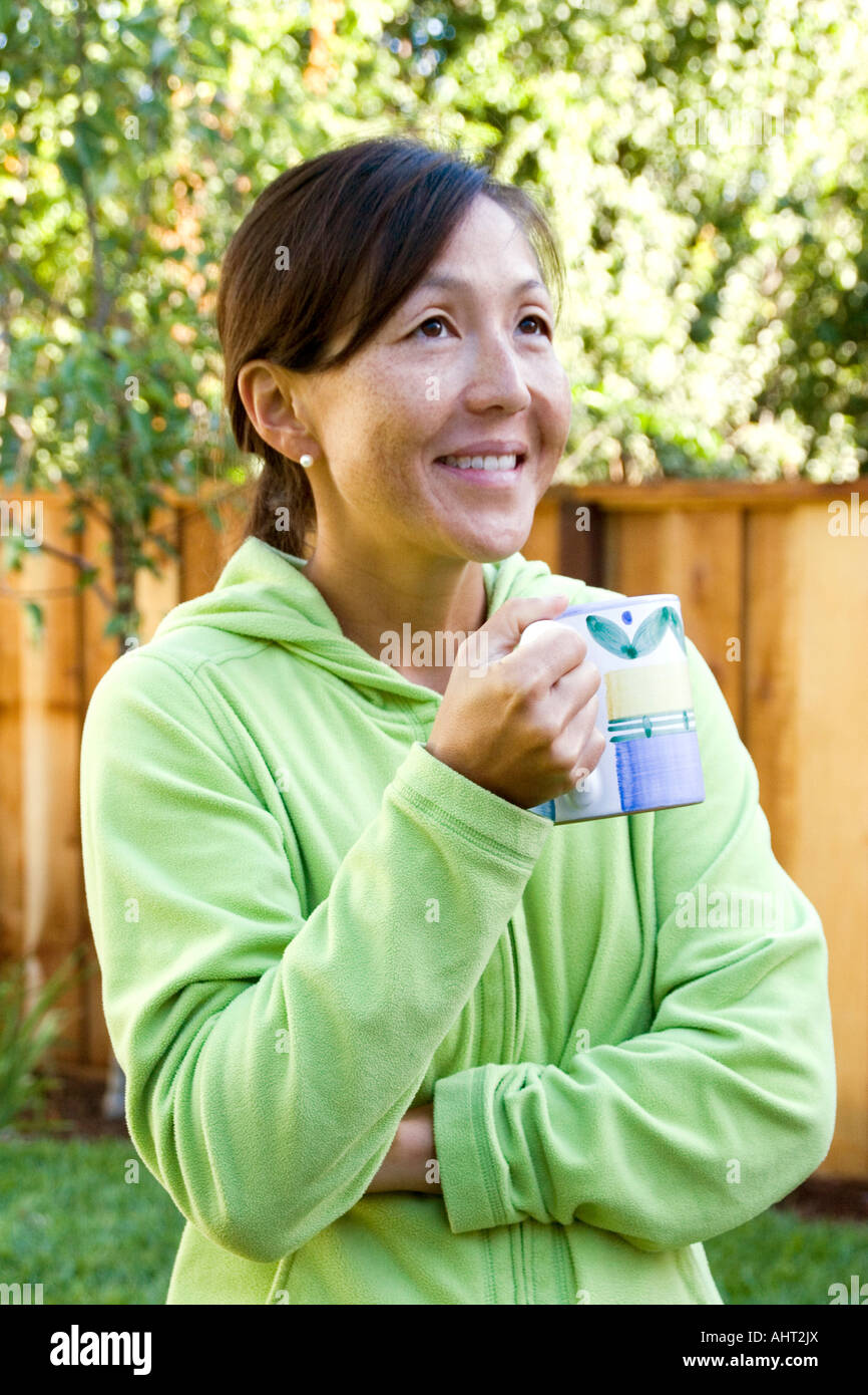 Woman Outside Drinking Coffee Stock Photo - Alamy Woman Outside Drinking Coffee Stock Photo - Alamy
