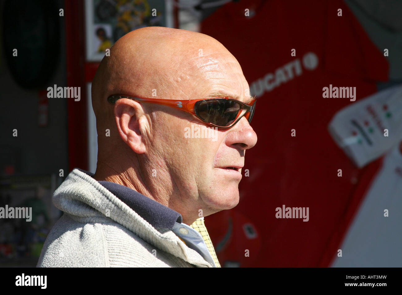 Profile of bald man in bright sun with sun glasses Stock Photo - Alamy